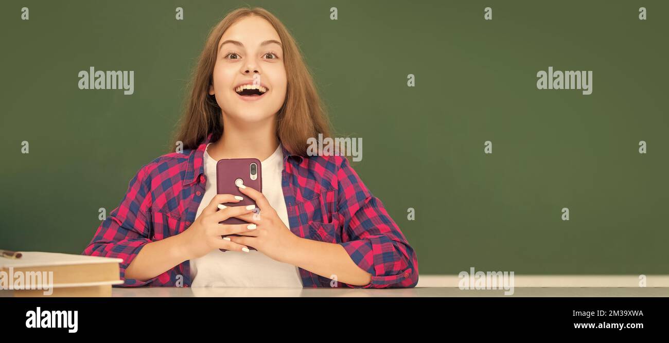 happy kid chat online in classroom. september 1. child typing and ...