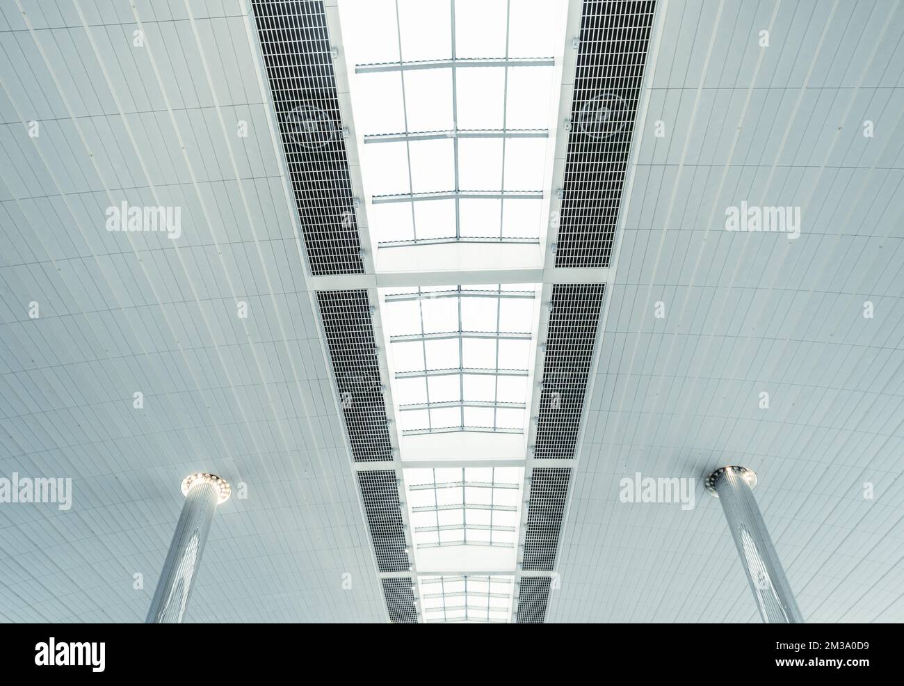 A big hall of lights on the ceiling with small rectangles radiating ...