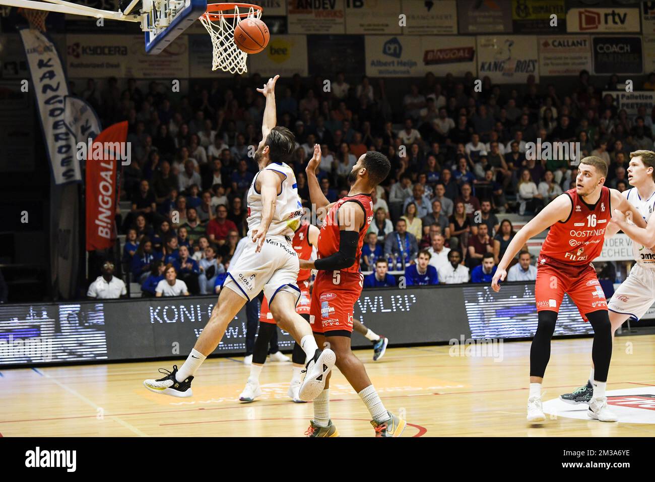 Mechelen's Domien Loubry and Oostende's Phil Booth pictured in action ...