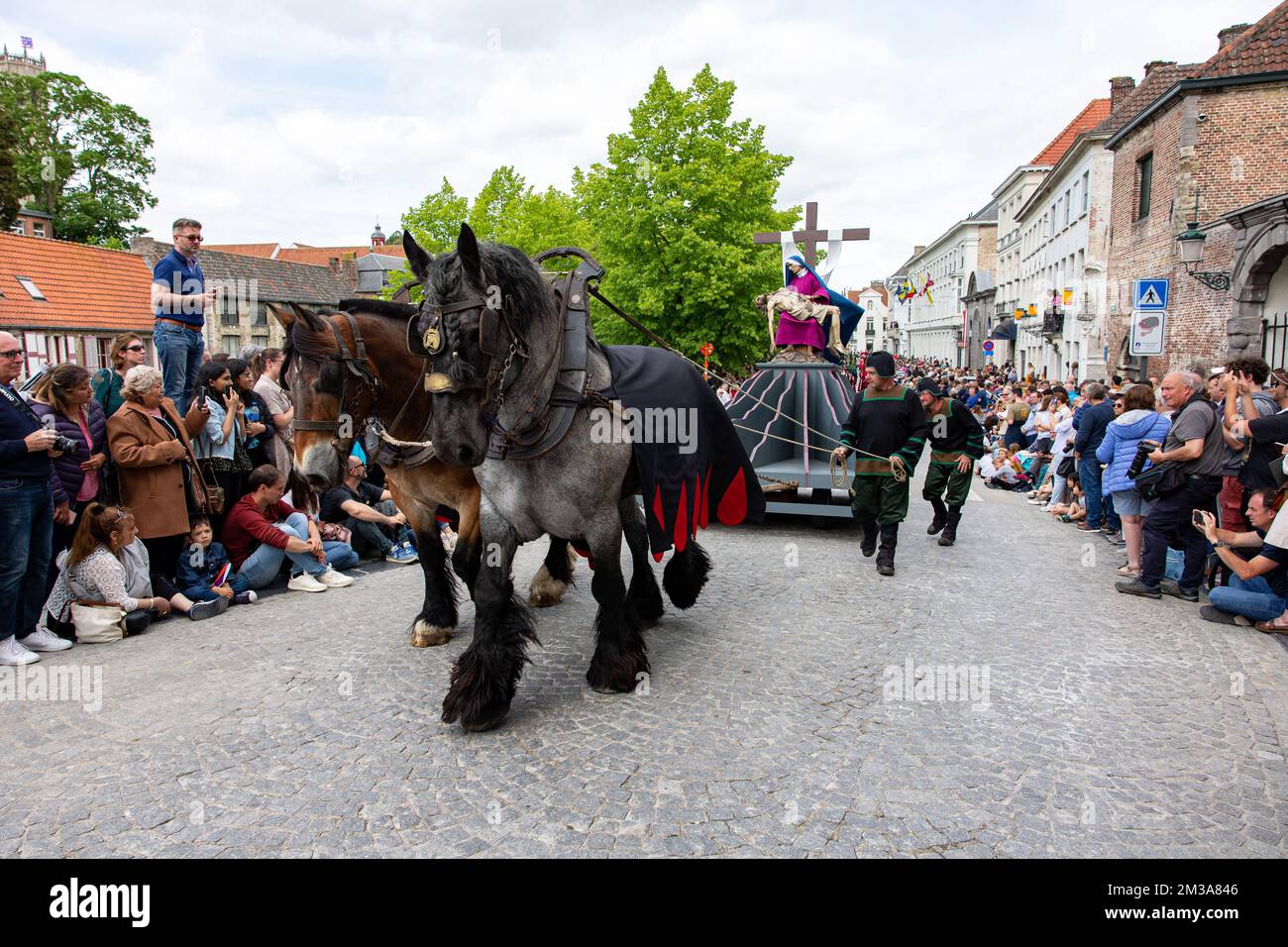 Illustration picture shows horses pulling a wagon with a pieta scene ...