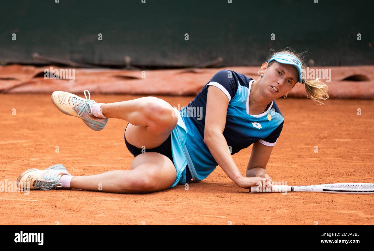Belgian Elise Mertens falls during a tennis match against Russian ...