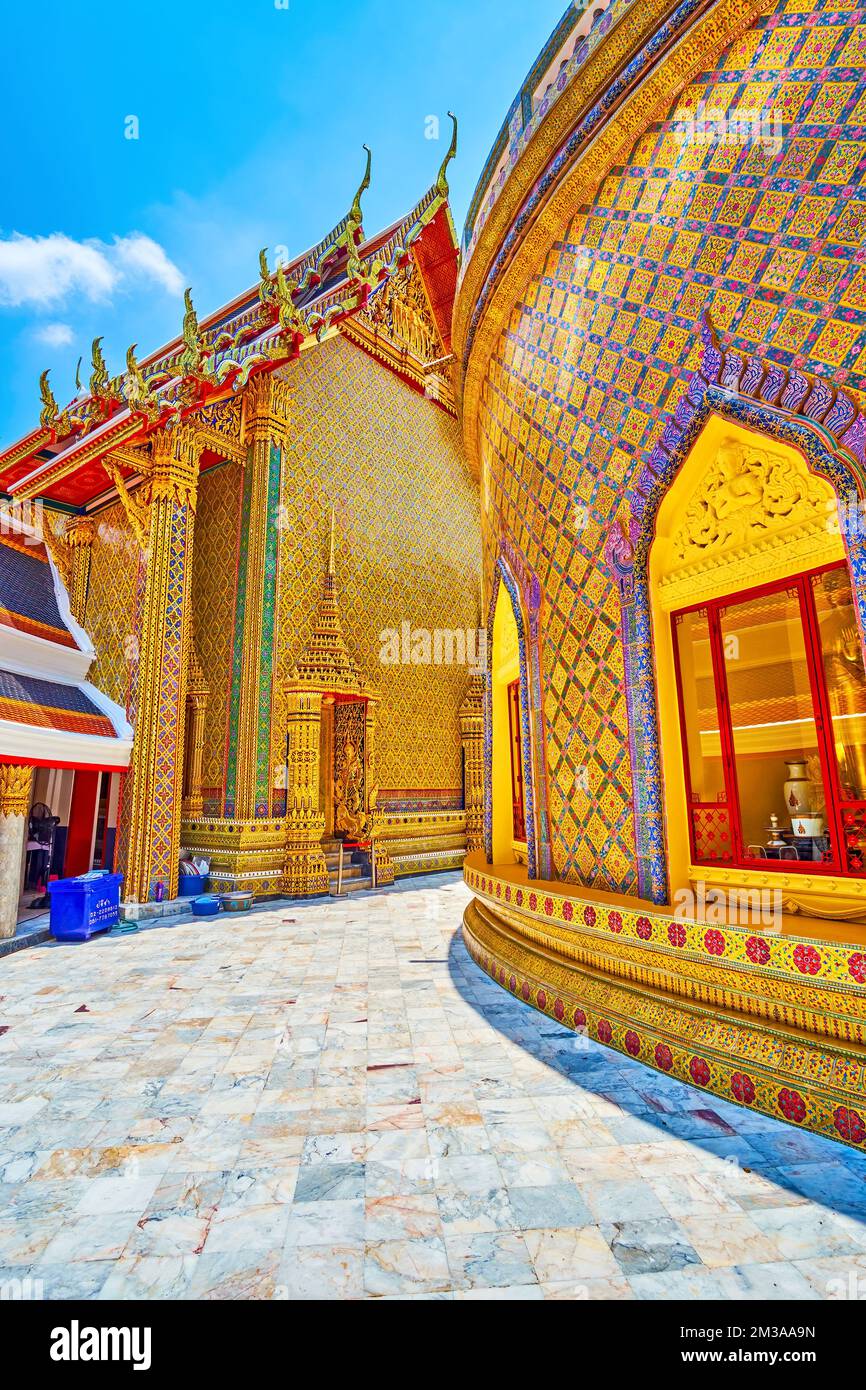 The round courtyard and golden shrines of Wat Ratchabophit temple ...
