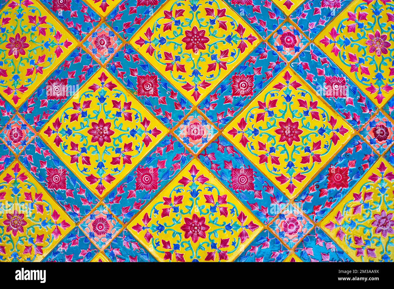 Walls of Phra Prang decorated with colorful porcelain tiles with floral ...