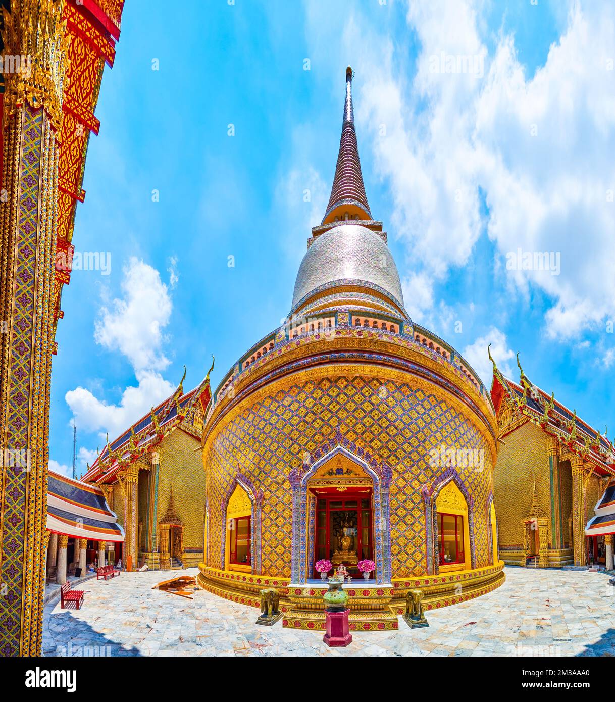 Panorama of golden Phra Prang and round courtyard of Wat Ratchabophit ...