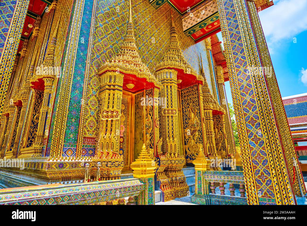 The golden entrance gates to the shrine in Wat Ratchabophit temple ...