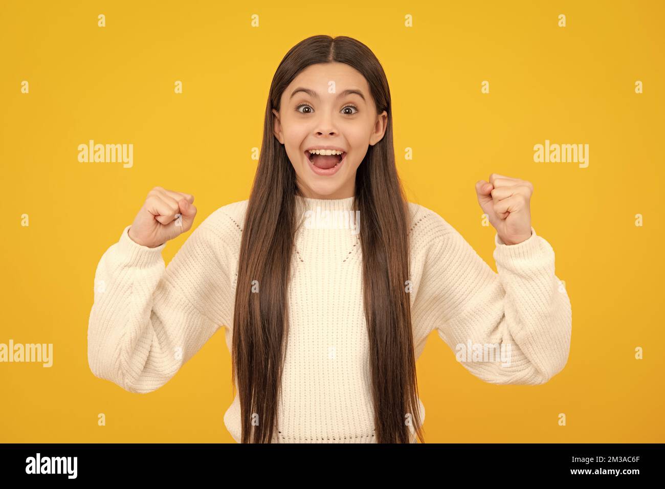 Teenager child girl rejoicing, say yes, looking happy and celebrating ...