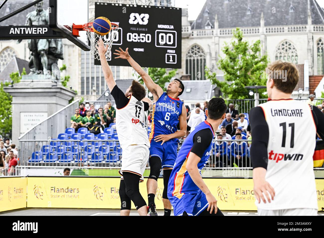 German Alan Boger and Mongolia's Dulguun Enkhbat fight for the ball ...