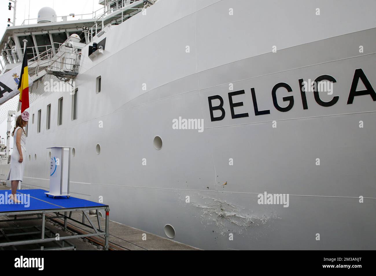 Crown Princess Elisabeth swings a bottle of champagne to the hull of ...