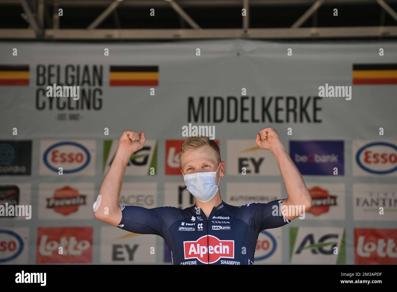 Belgian Tim Merlier of Alpecin-Fenix celebrates on the podium after ...