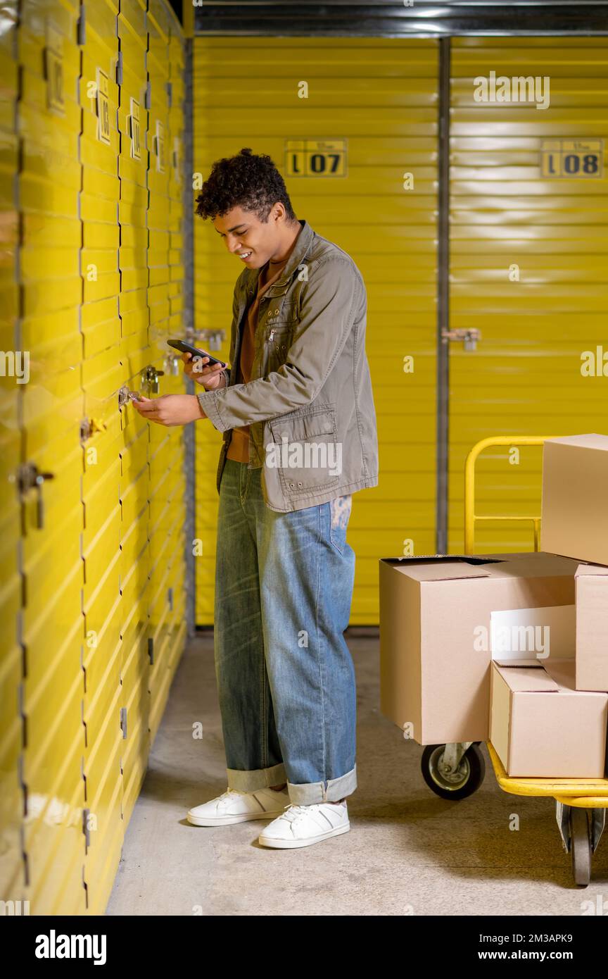 Warehouse worker opening the smart lock Stock Photo - Alamy