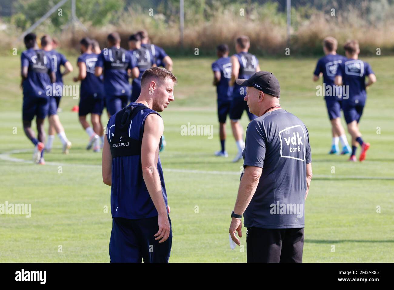 an unidentified player and Gent's assistant coach Peter Balette ...