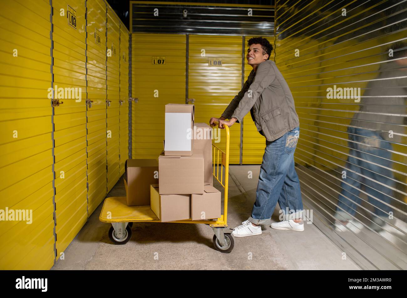 Dark warehouse boxes hi-res stock photography and images - Alamy