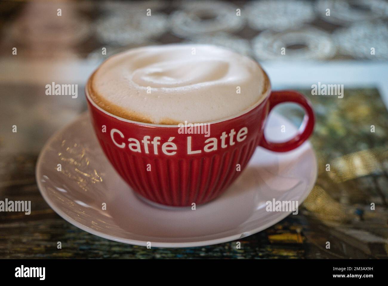 Cappuccino in vintage red mug Stock Photo - Alamy