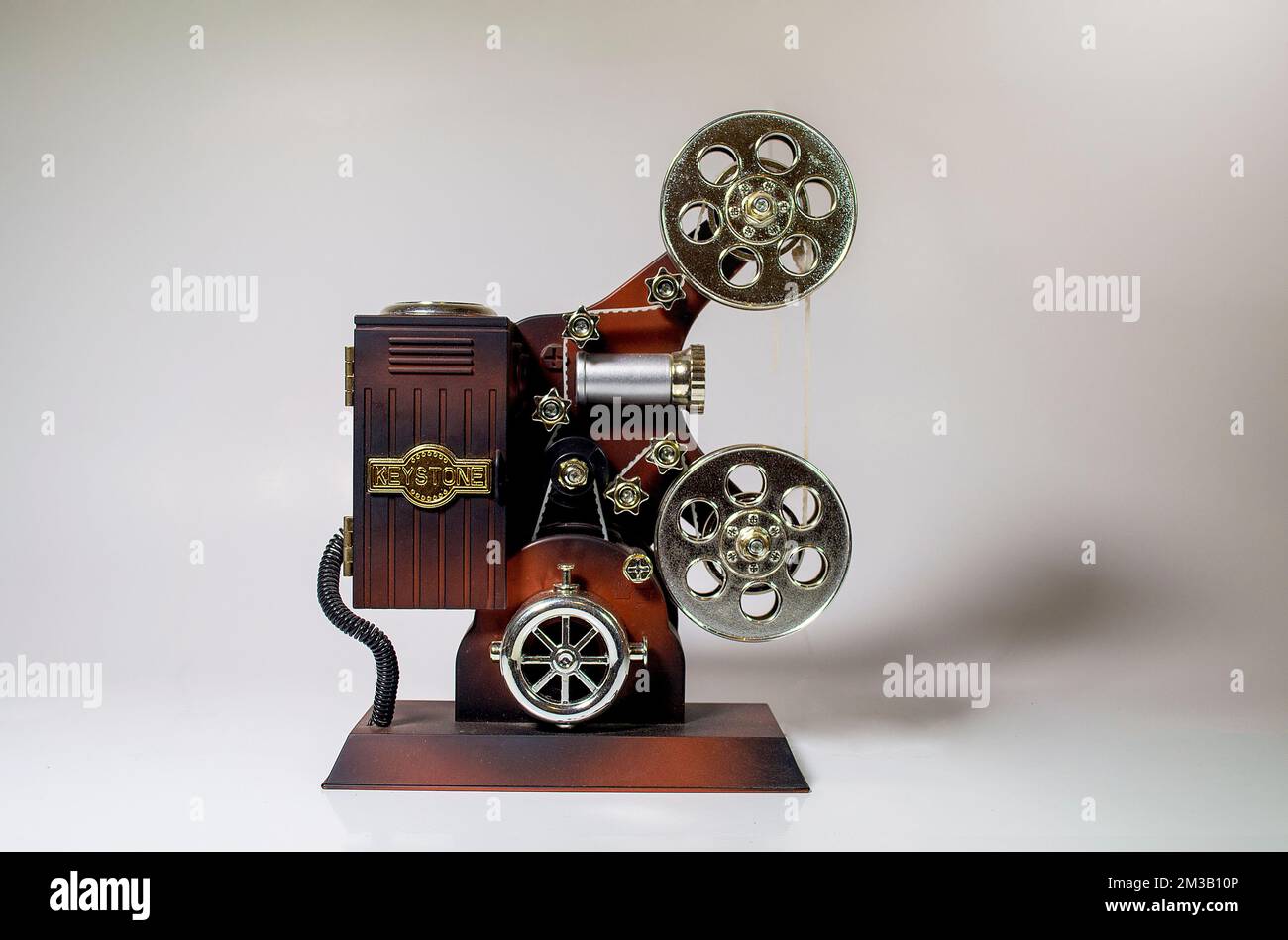 Music box shaped like an old cinema camera profile view with white ...