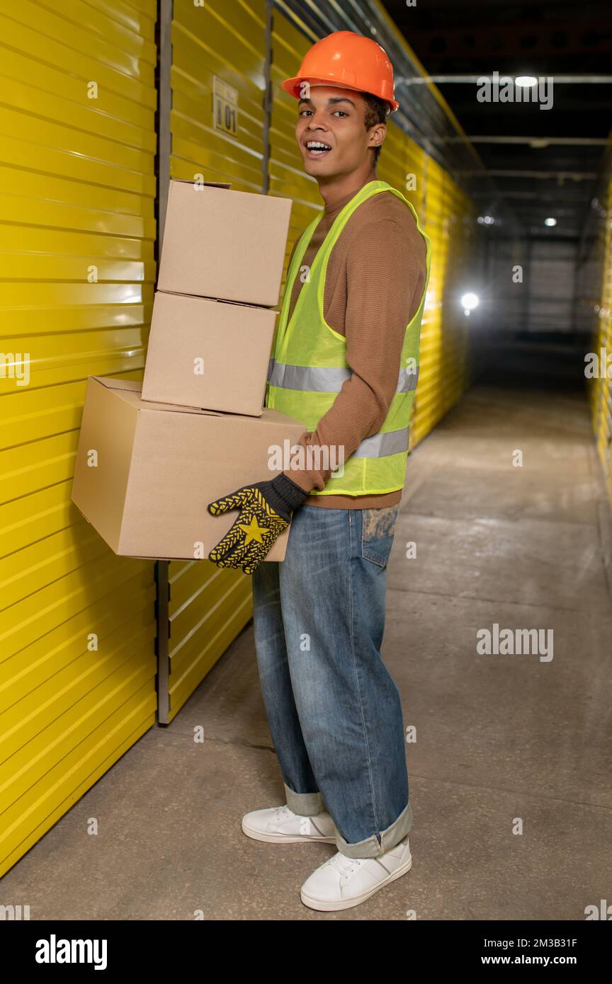Worker of the warehouse working and looking busy Stock Photo - Alamy