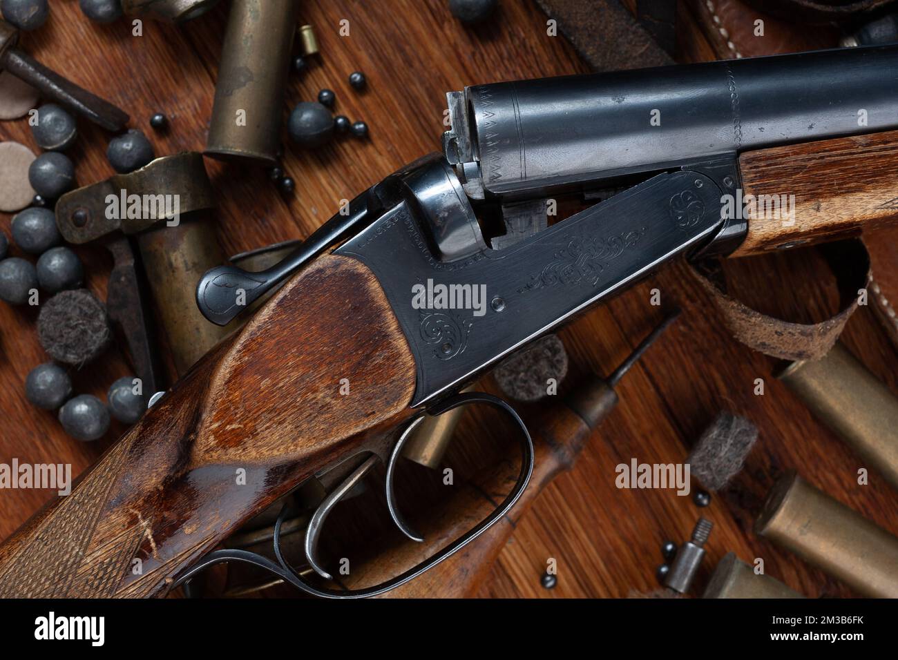 Antique 16-gauge break-action smooth-bored shotgun with brass cases and ...