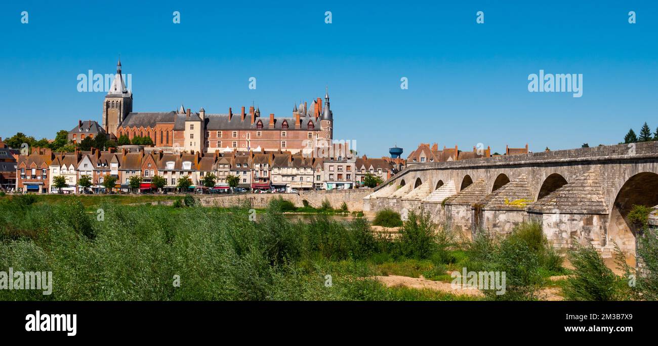 View of Gien with the castle and the old bridge across Loire river ...