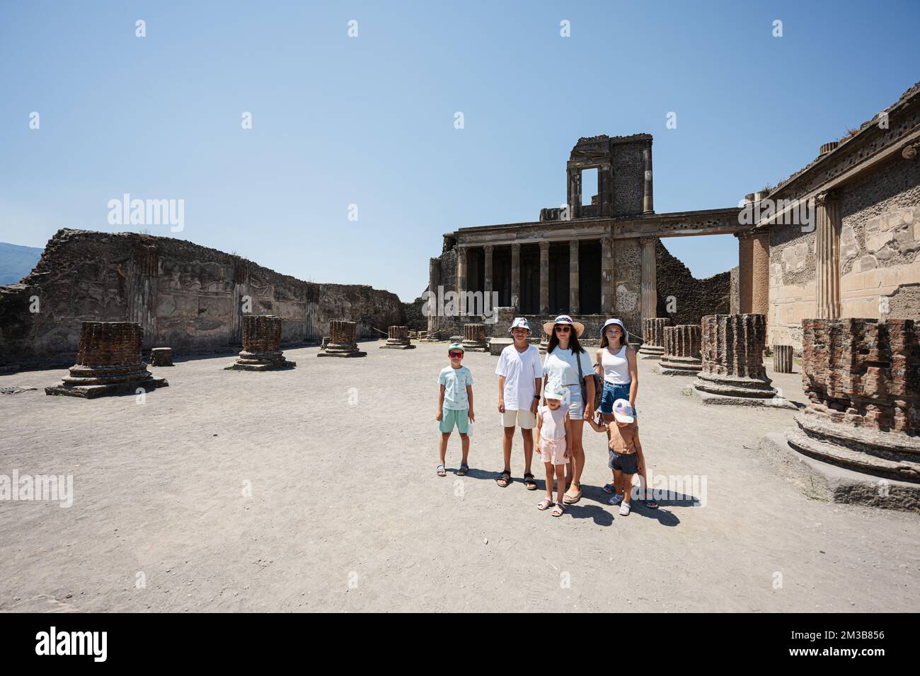 Family tourist visit Pompeii ancient city, Italy Stock Photo - Alamy