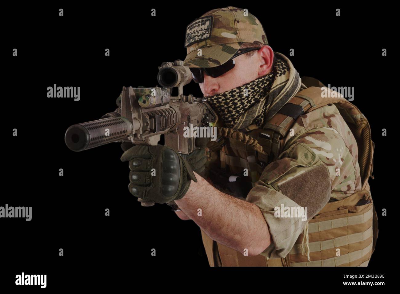 Private Military Company operator with assault rifle on black ...