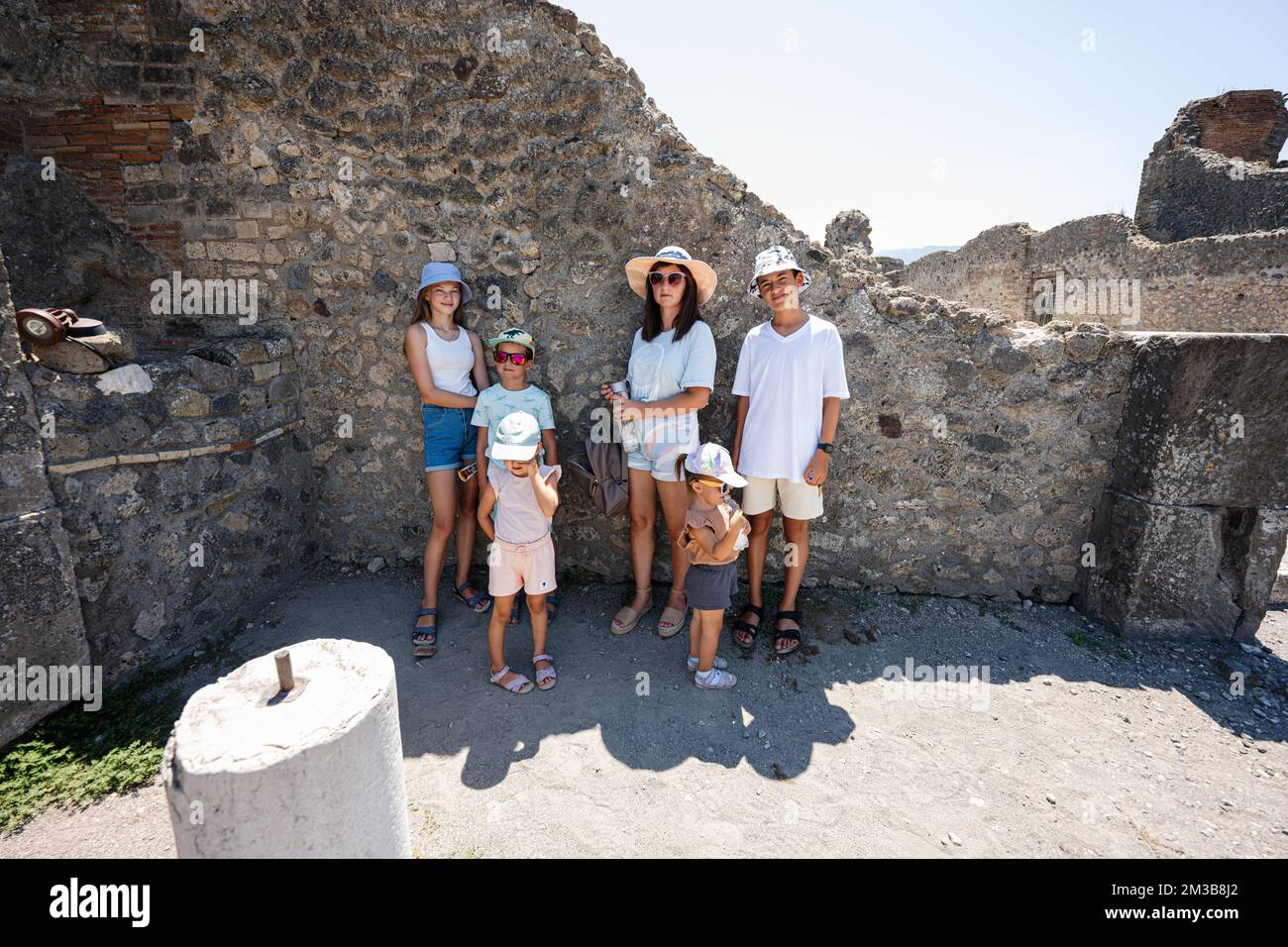 Family tourist visit Pompeii ancient city, Italy Stock Photo - Alamy