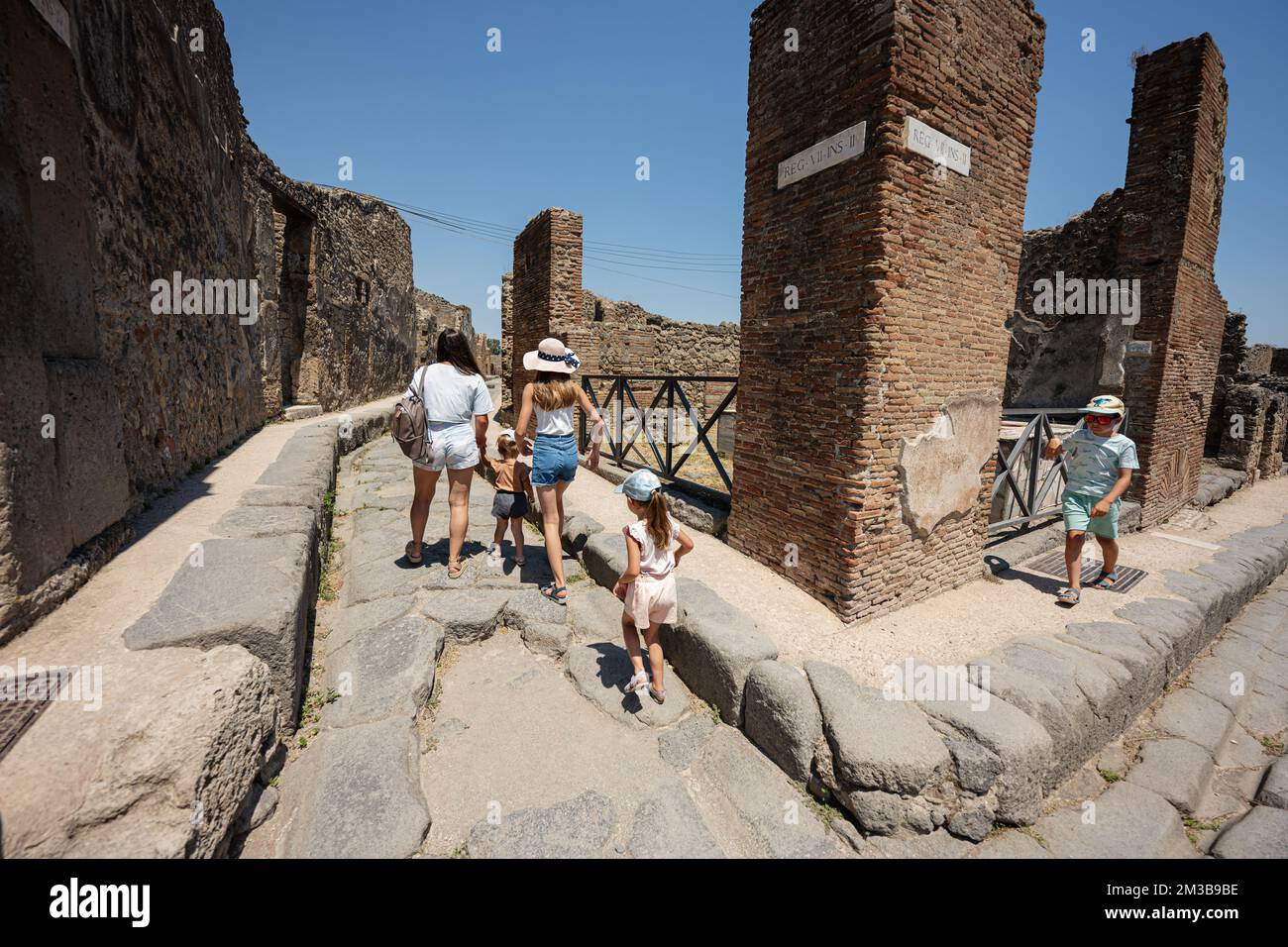 Family tourist walking at Pompeii ancient city, Italy Stock Photo - Alamy