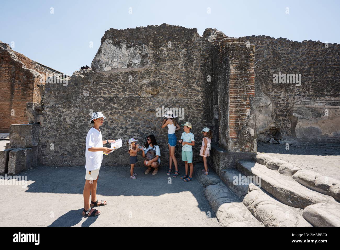 Family tourist visit Pompeii ancient city, Italy Stock Photo - Alamy