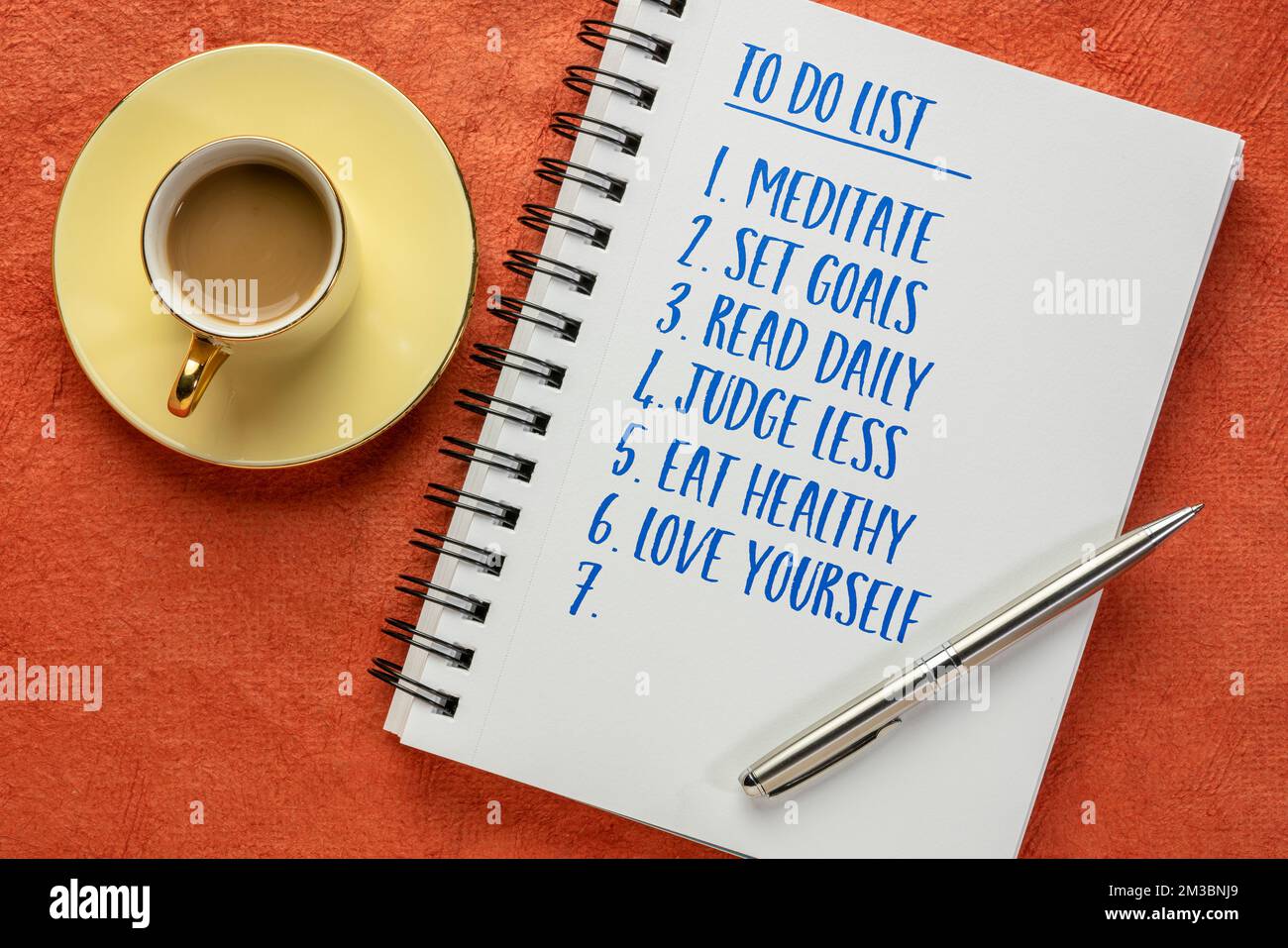 inspirational to do list in a notebook - meditate, set goals, read ...