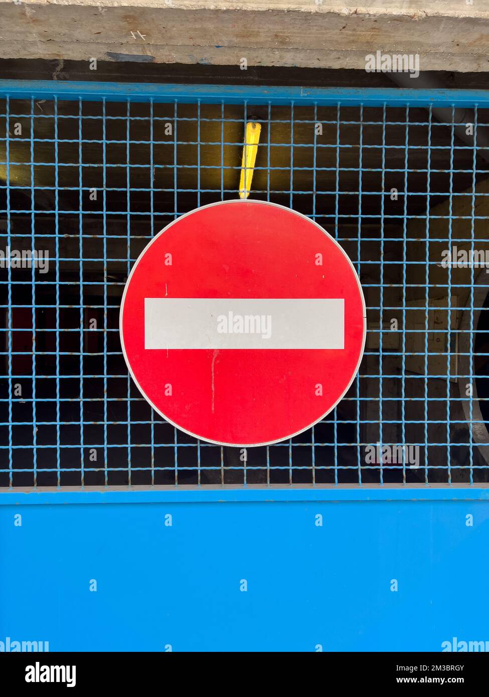 do not enter road sign on blue fence mobile photo Stock Photo - Alamy