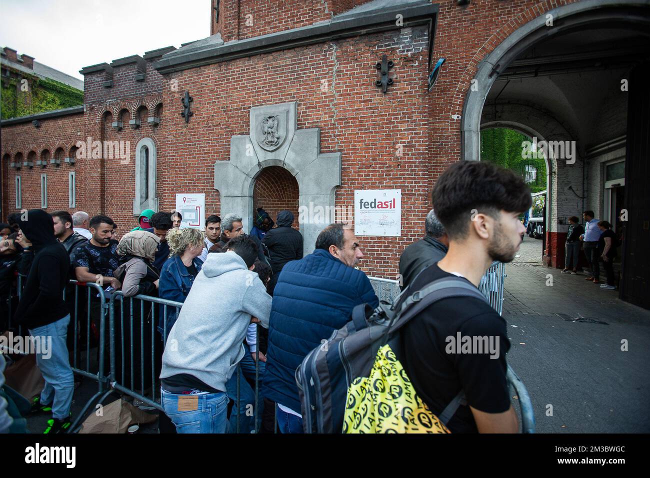Illustration picture shows dozens of asylum seekers waiting at the ...