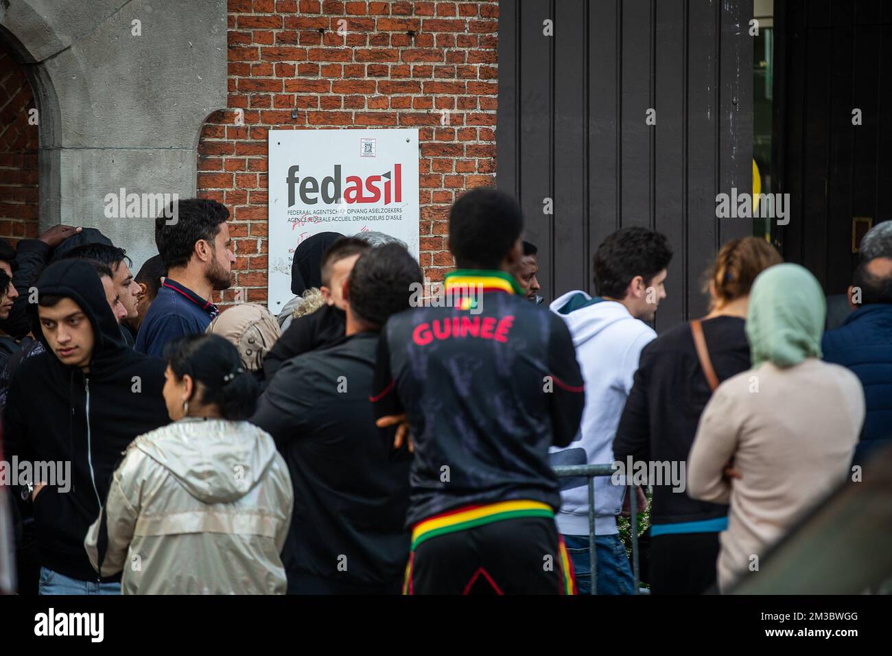 Illustration picture shows dozens of asylum seekers waiting at the ...