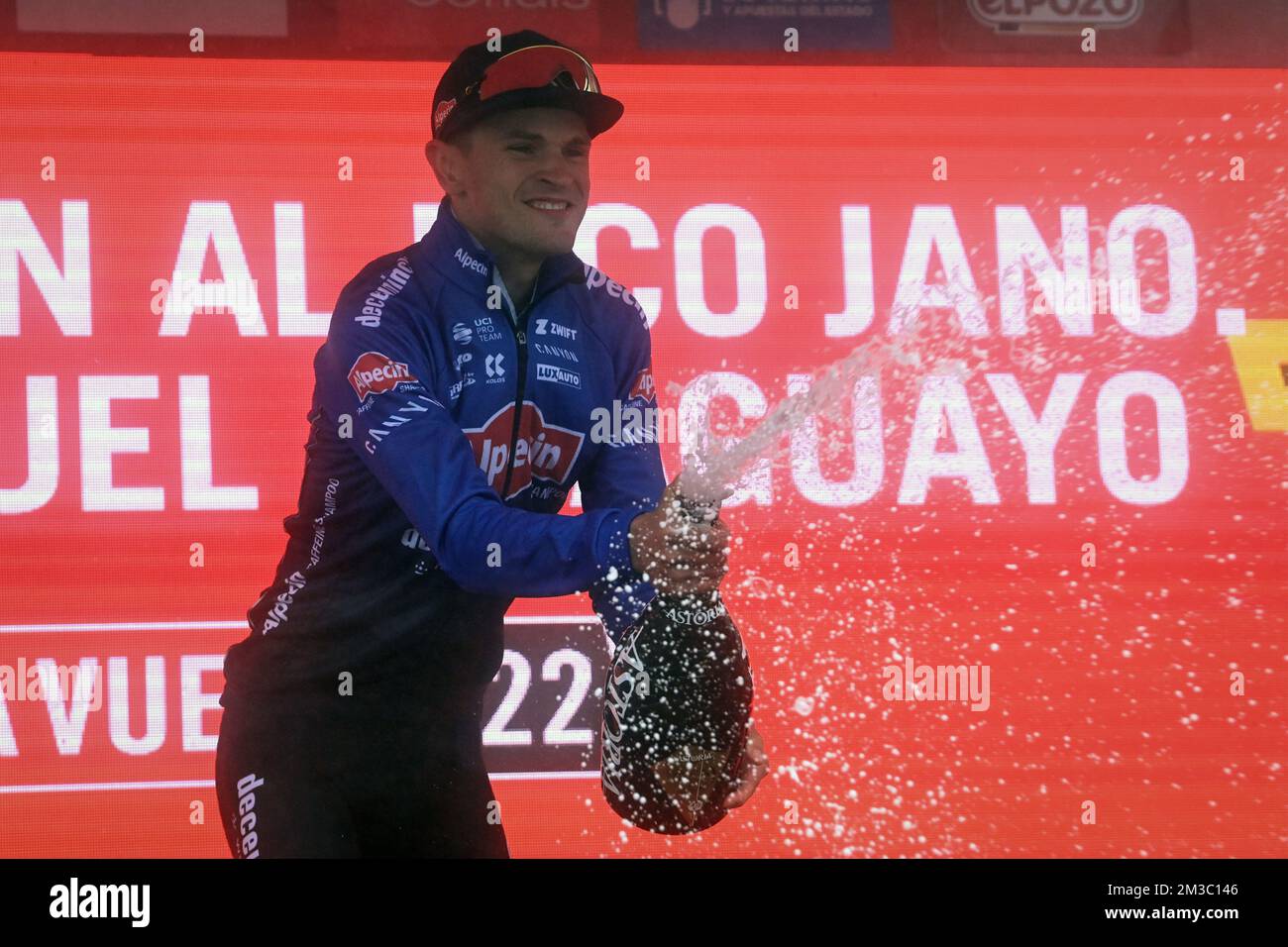 Australian Jay Vine of Alpecin-Deceuninck celebrate on the podium with ...