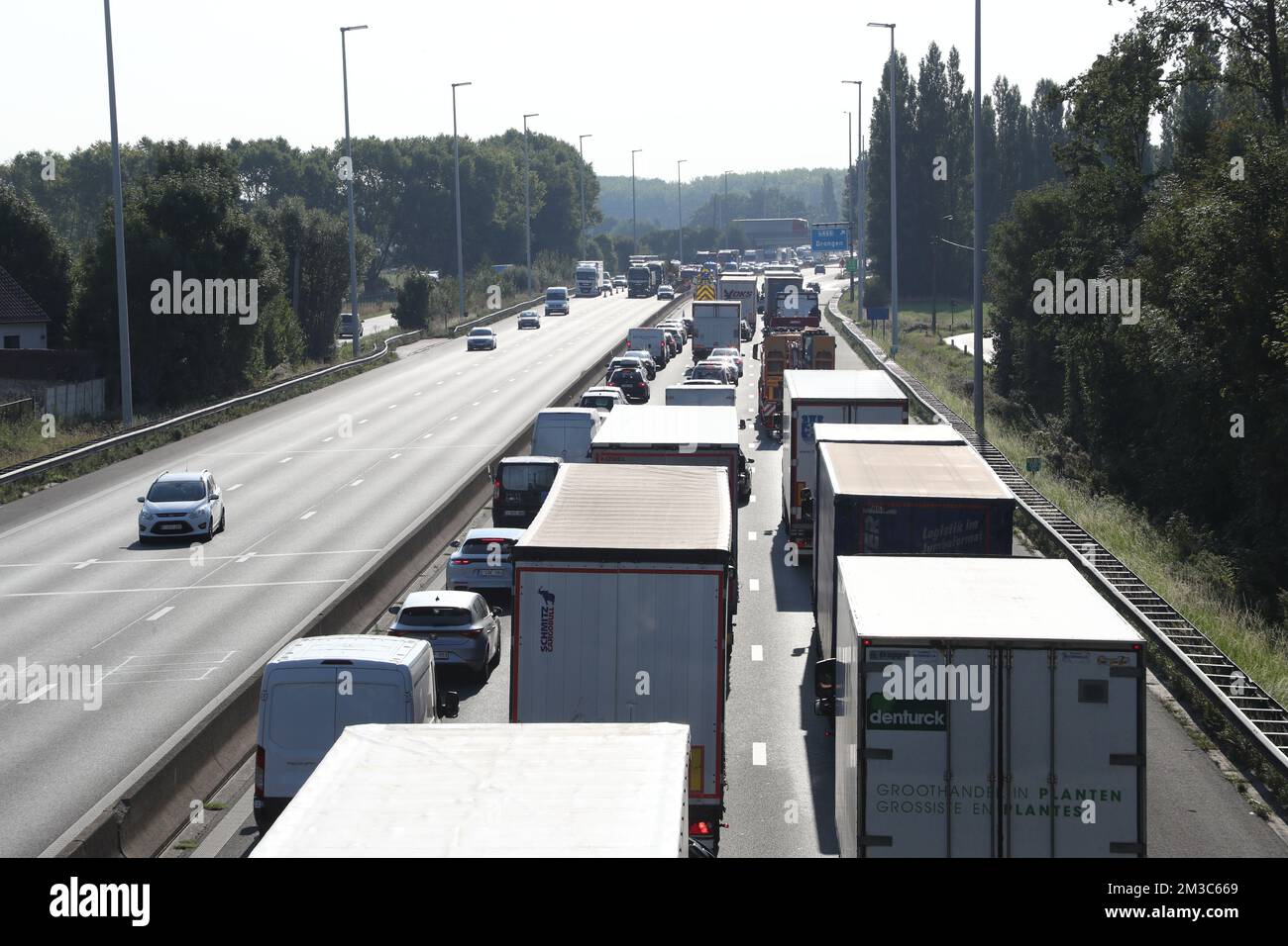 Illustration picture shows traffic congestion with lots of trucks and cars after an accident ...