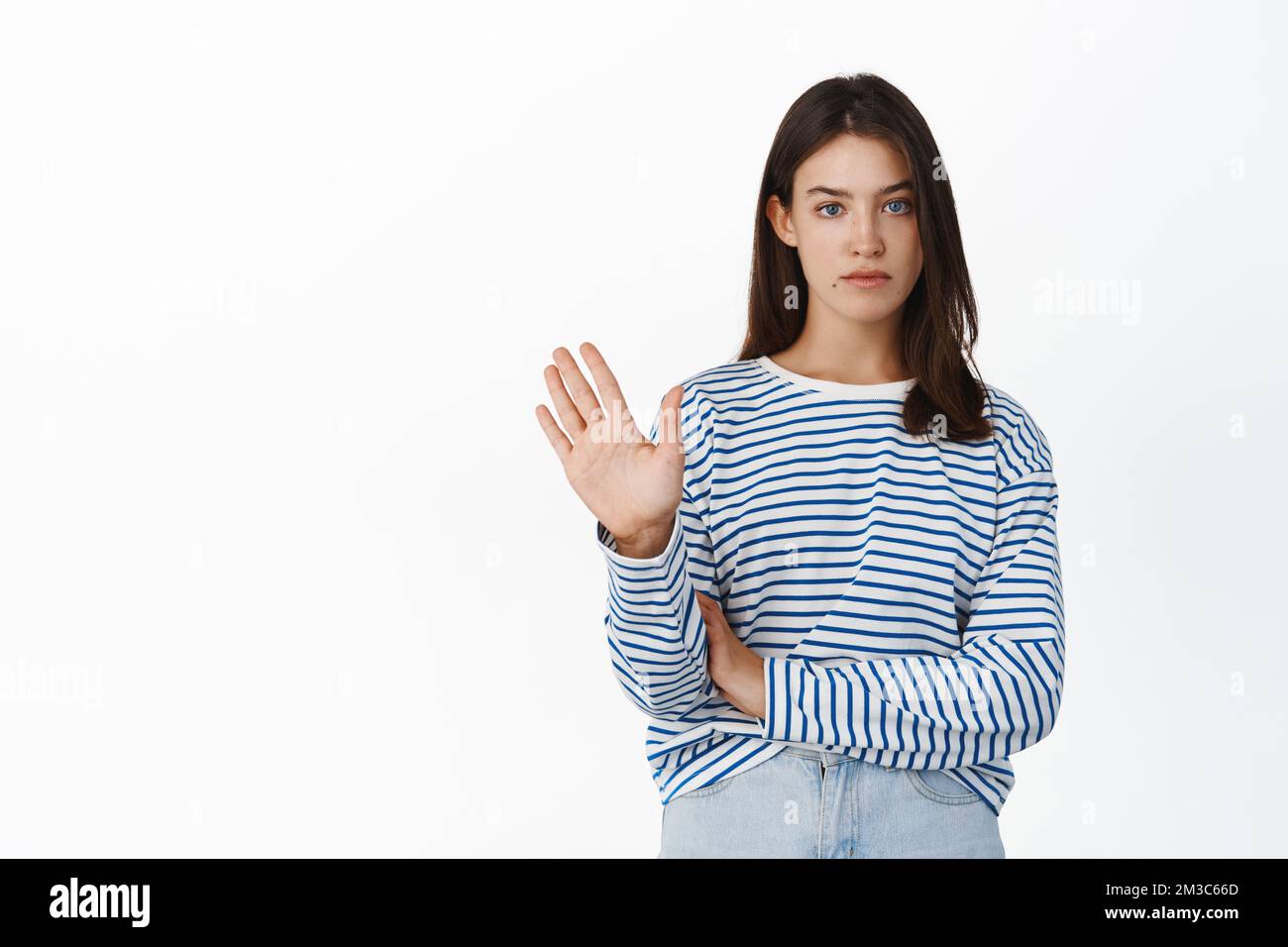 Image of serious reluctant girl rejecting, waving hand to give negative ...