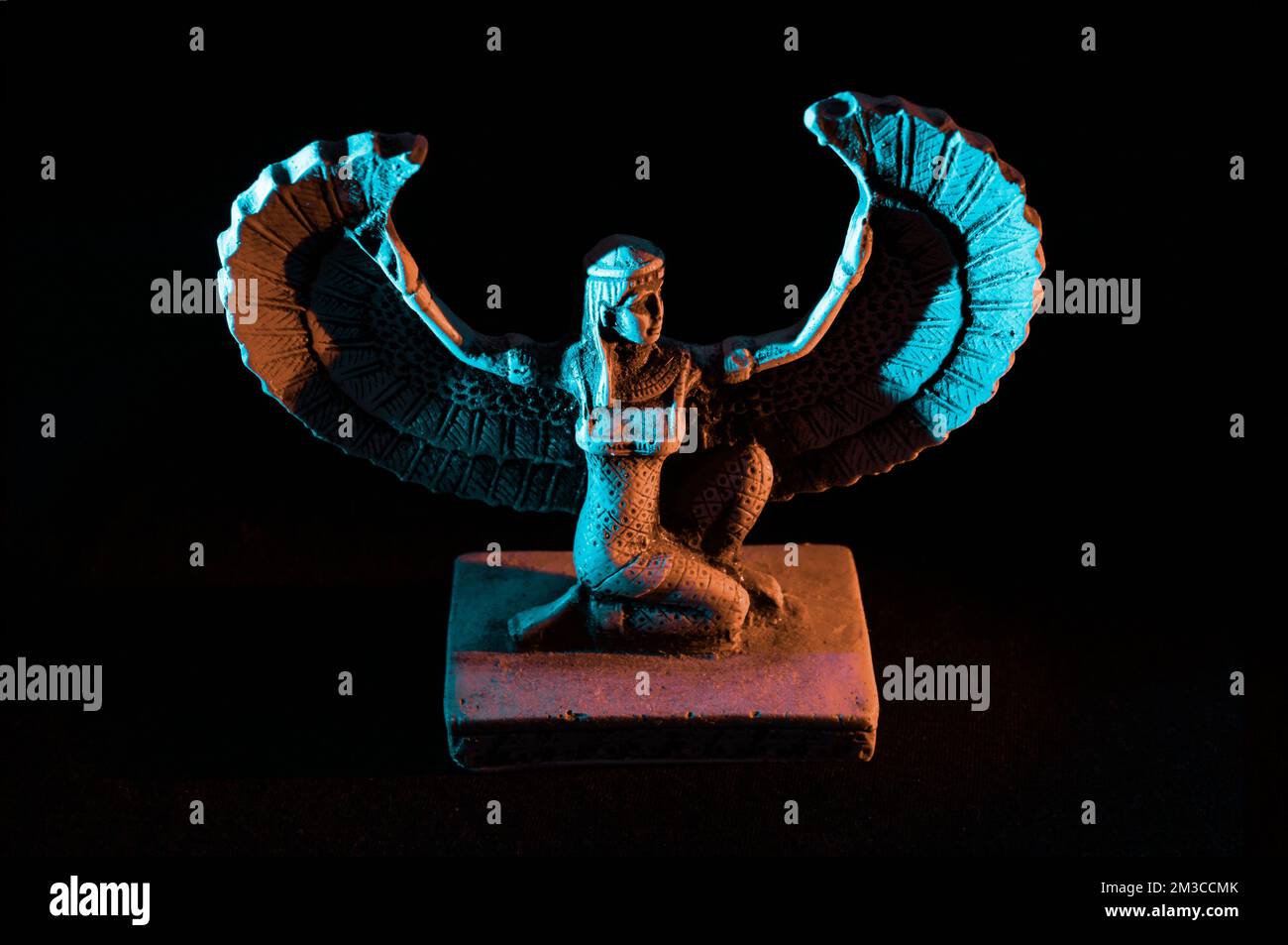 Closeup to a Isis. female old winged egyptian god mini figurine ...