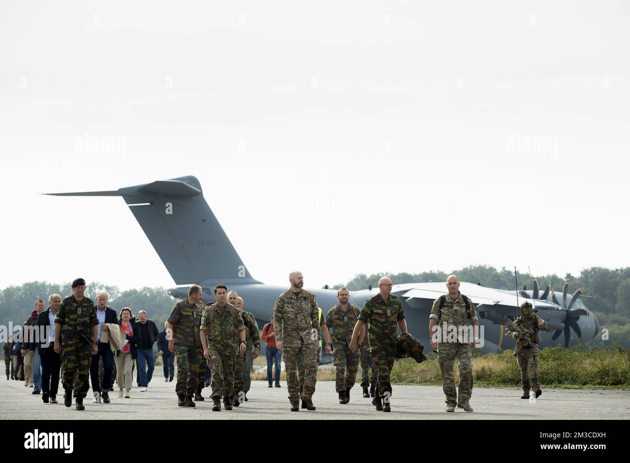 Passengers arrive on the tarmac during a press briefing on Storm Tide ...