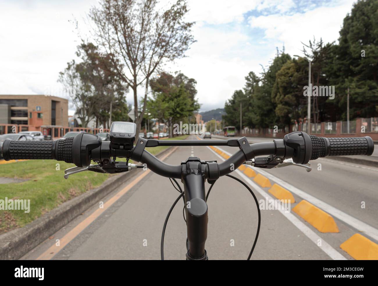 First person view of a handle bars and setam bicycle over a bike path ...