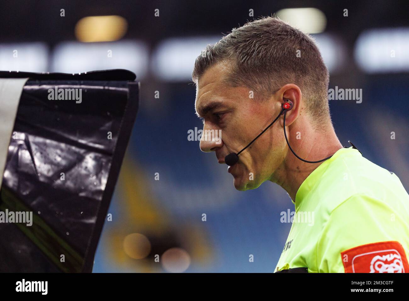 referee Jonathan Lardot pictured watching a scene on the VAR video ...