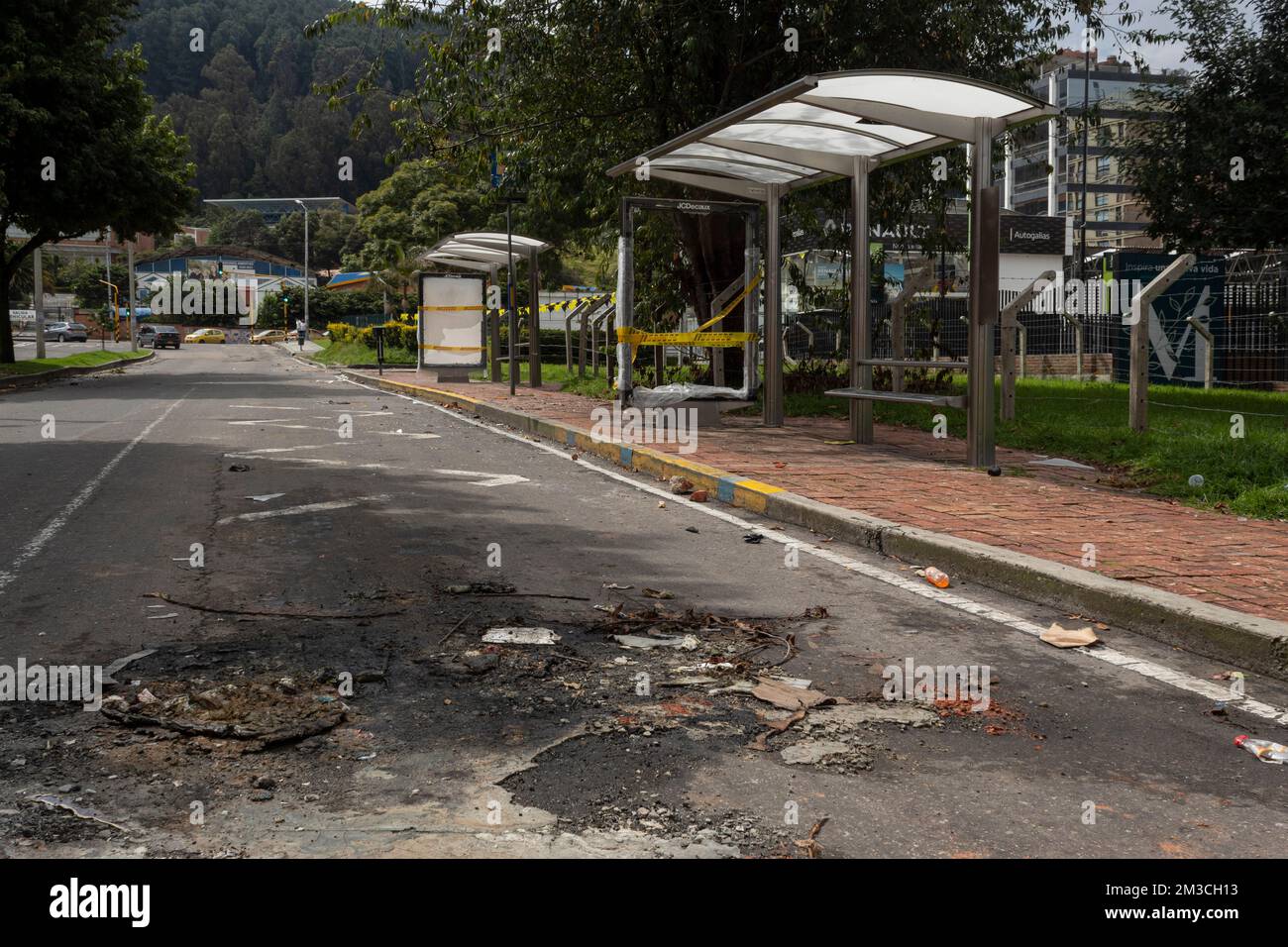 BOGOTA, COLOMBIA - bus stop destroy and burn pavement with a lot of ...