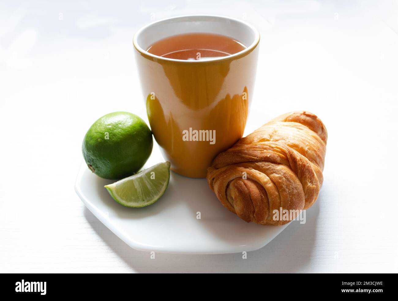 A yellow mug with Colombian traditional hot drink knowed as AGUA DE ...