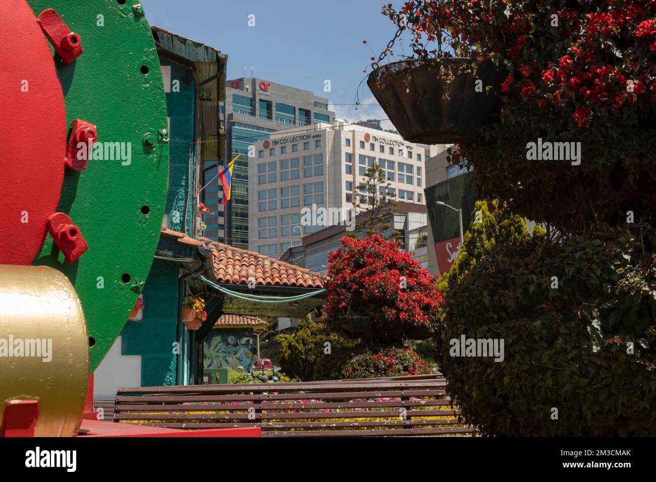 BOGOTA, COLOMBIA A beautiful summer usaquen scene with red flowers, an ...
