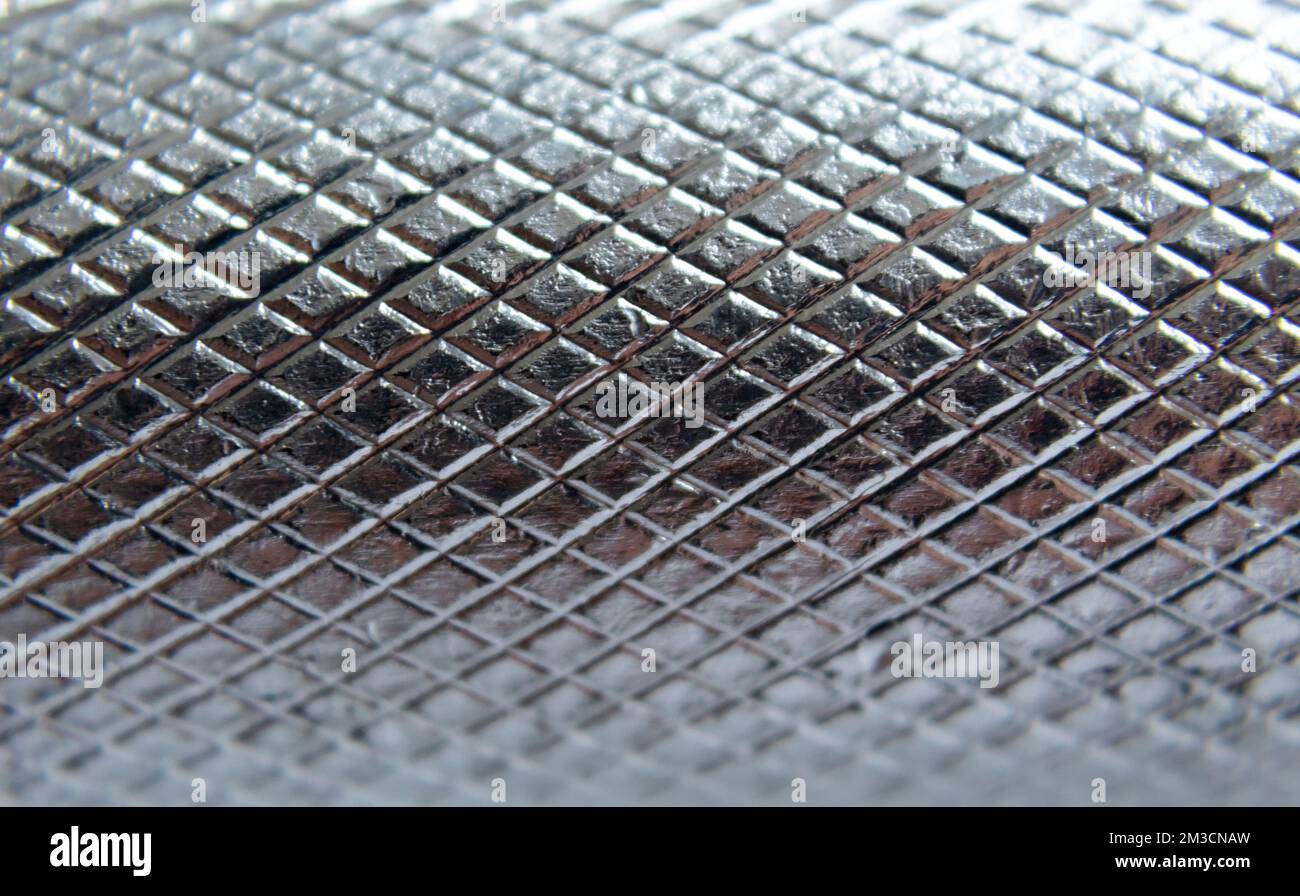 Macro photography to an iron geometric pattern of a dumbbell piece ...