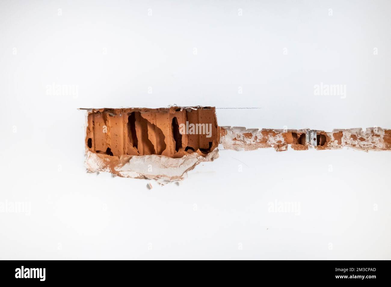 cable canal in a hollow block stone at white wall Stock Photo - Alamy