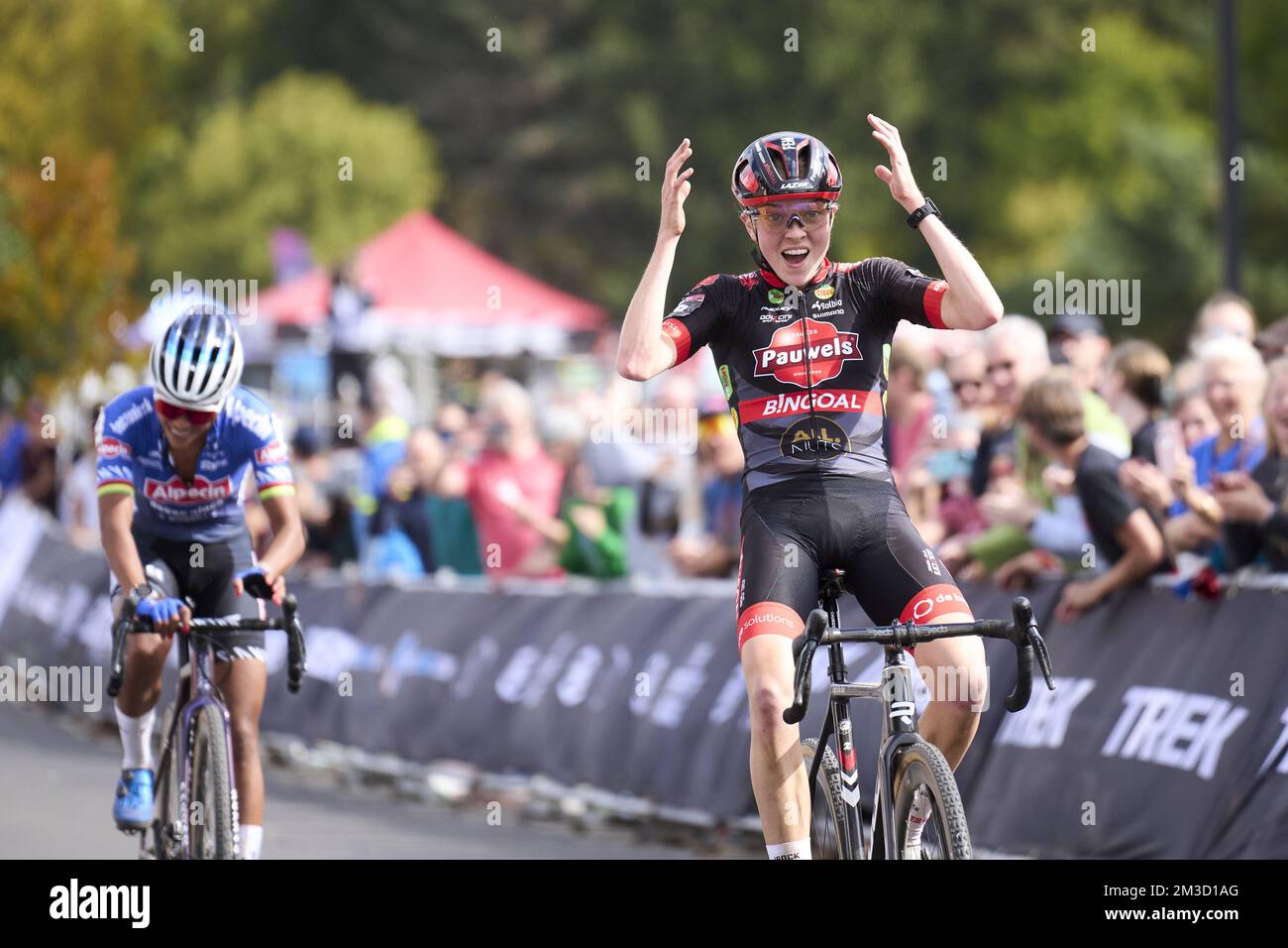 Dutch Fem Van Empel celebrates as she crosses the finish line to win ...