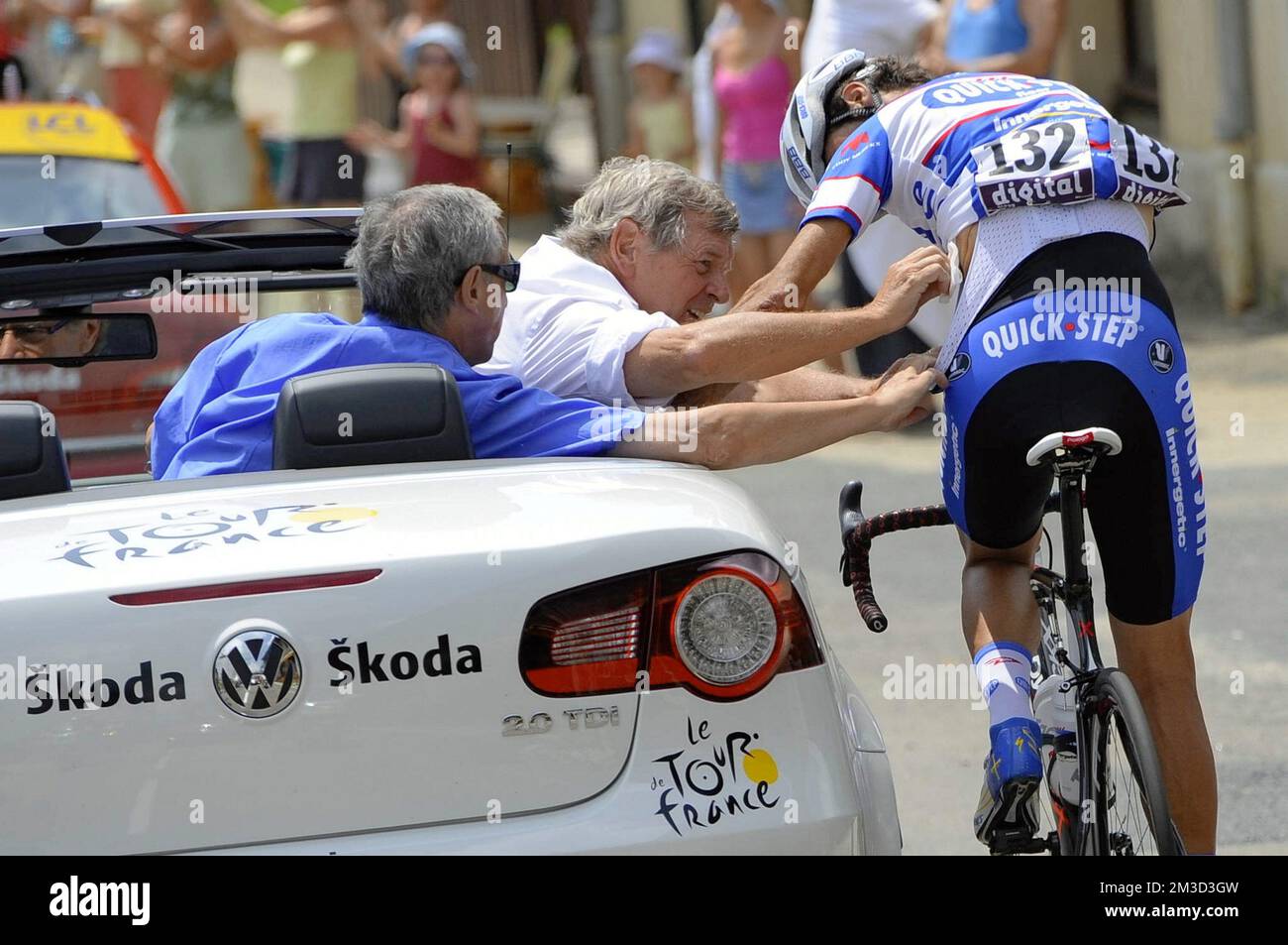 A Tour De France staff member treats Spanish Carlos Barredo of team ...