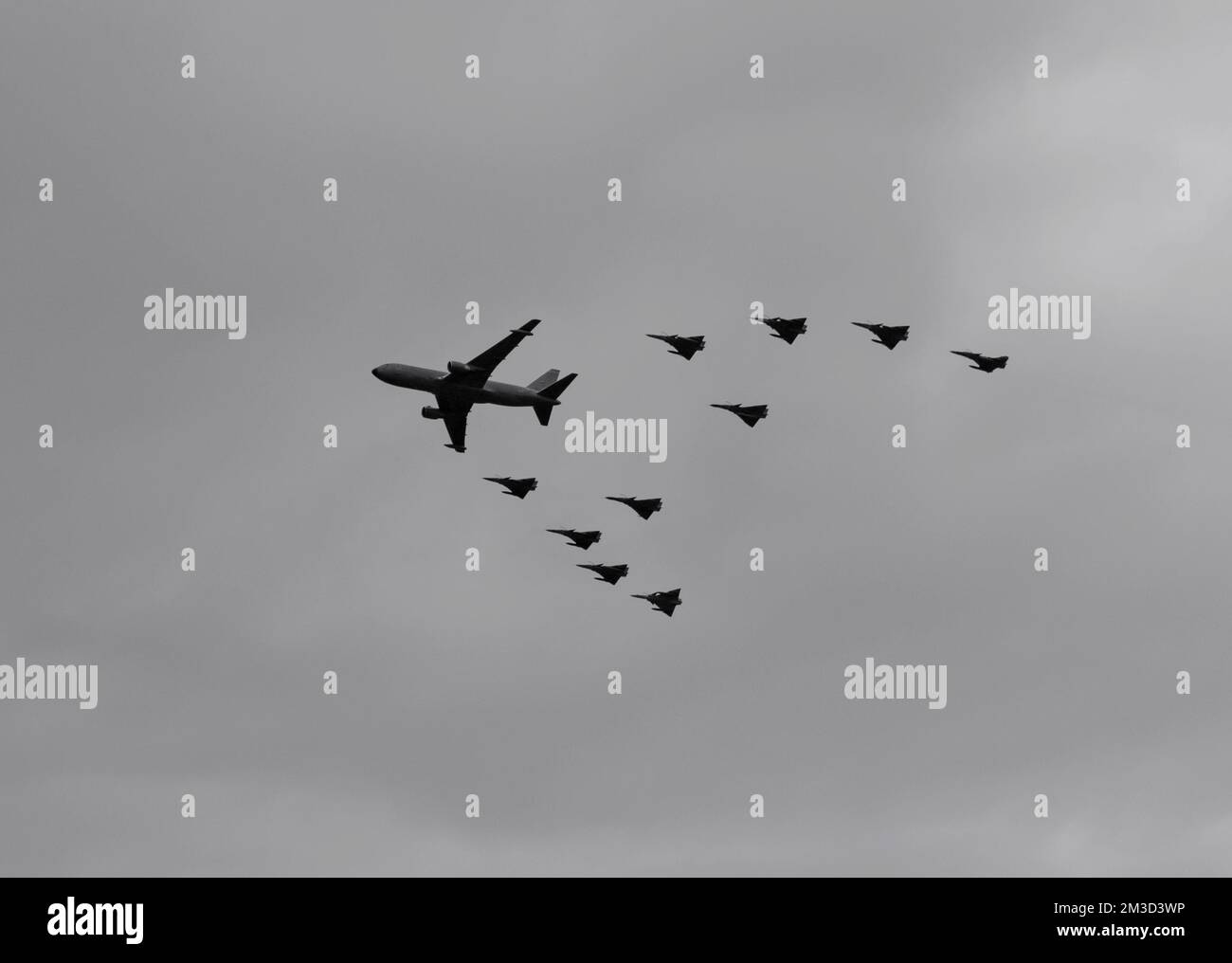 Military airplanes flying in V formation with grey and cloudy day at ...
