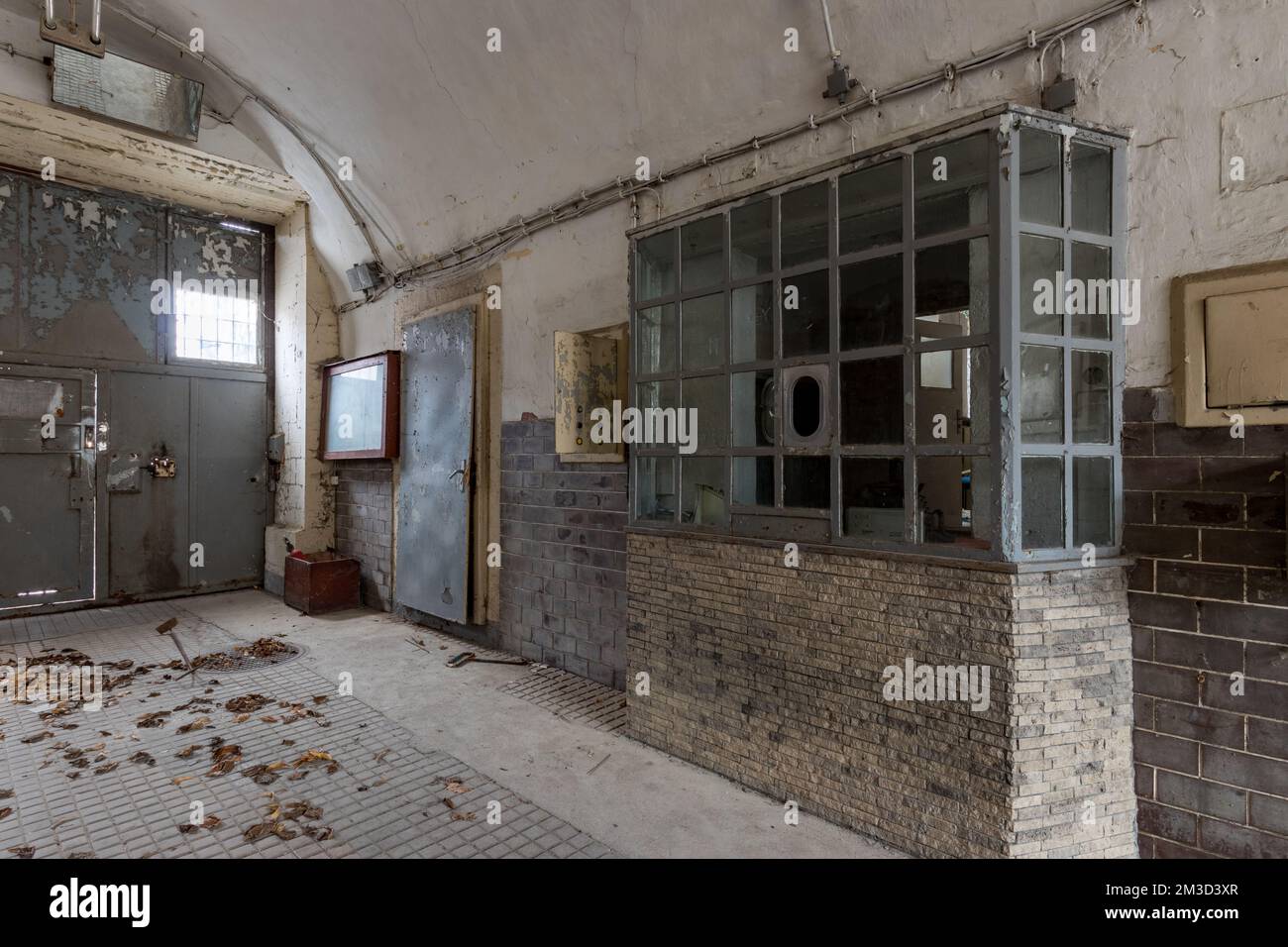 An entrance gate of an old abandoned prison Stock Photo - Alamy