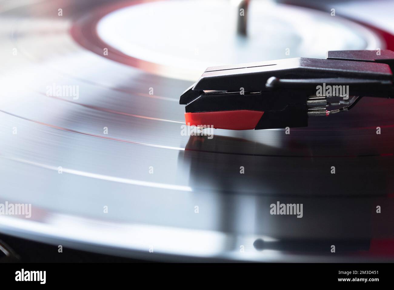 close up to red turntable needle and LP vinyl playing music Stock Photo ...
