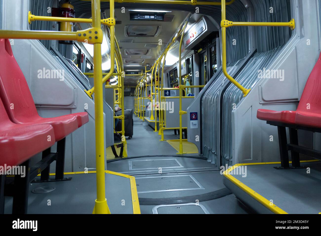 BOGOTA, COLOMBIA - A transmilenio bus inside at night with one person ...