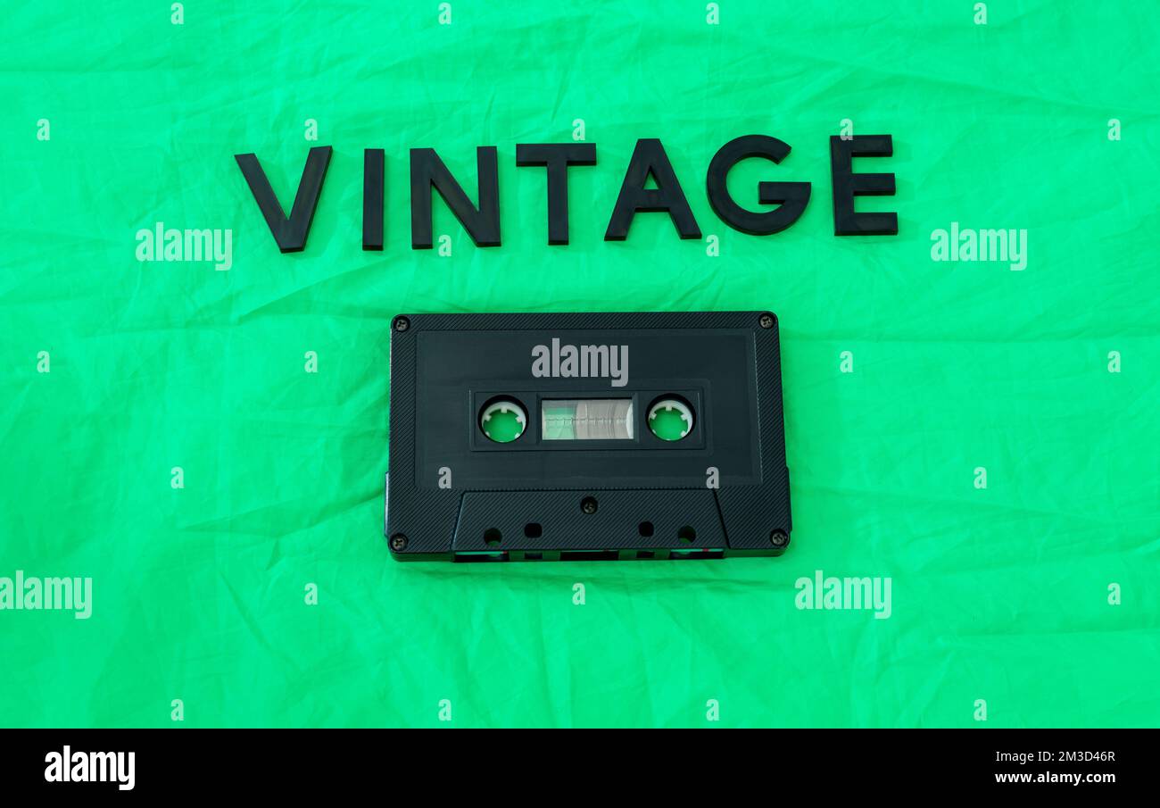 Top View of VINTAGE black lettering word with an old black cassette ...