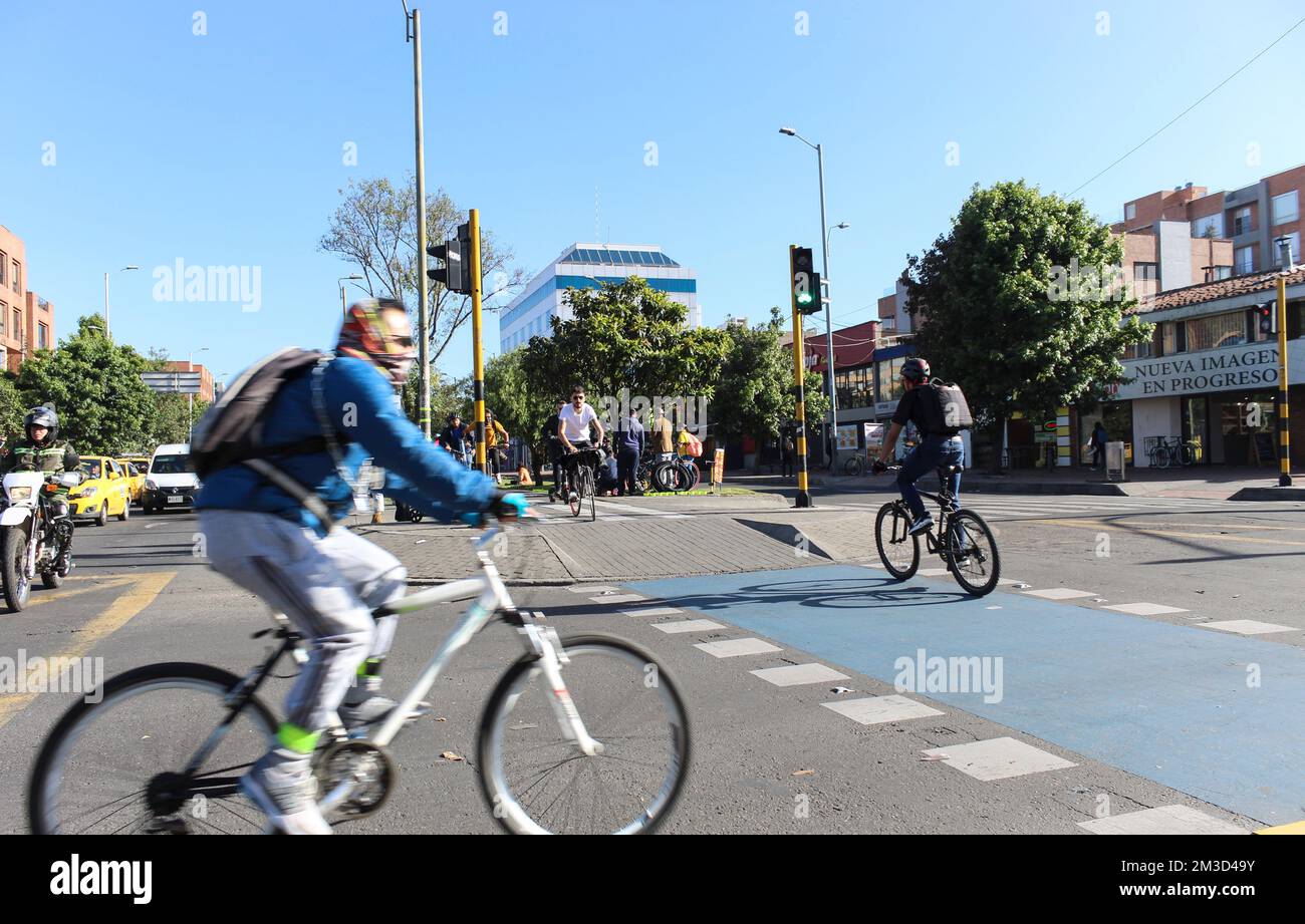 People riding bike or bicycle at the sunny morning at bogota's first No ...